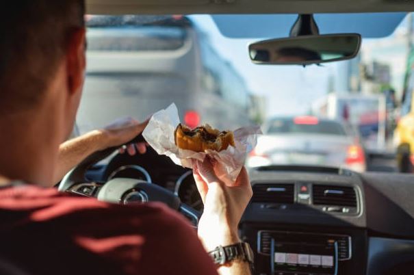 Is it Illegal to Eat While Driving? - Wolf & Pravato